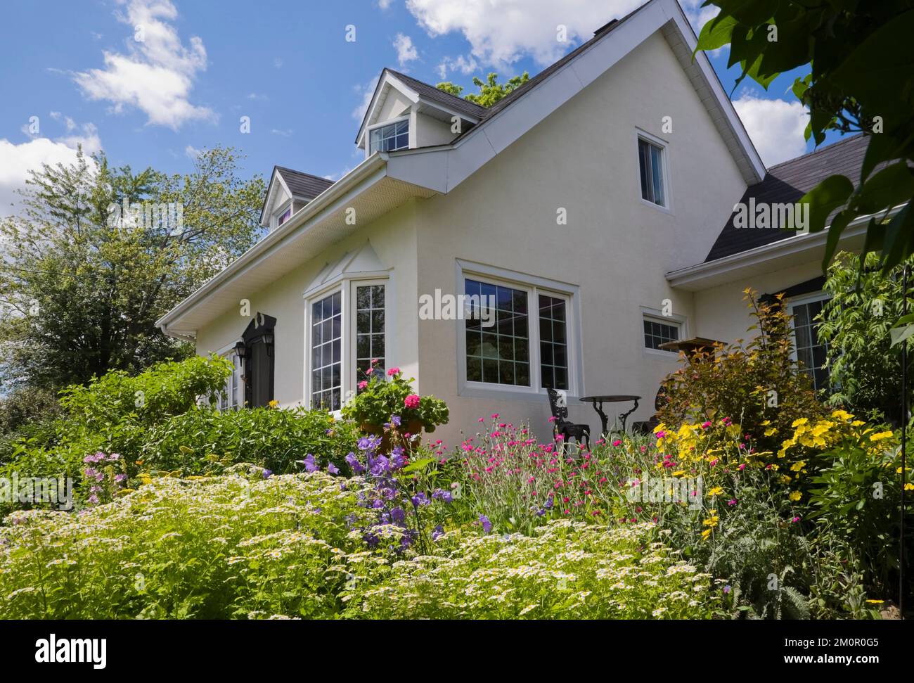 Two storied 1950s white with black trim French manor Canadiana style ...