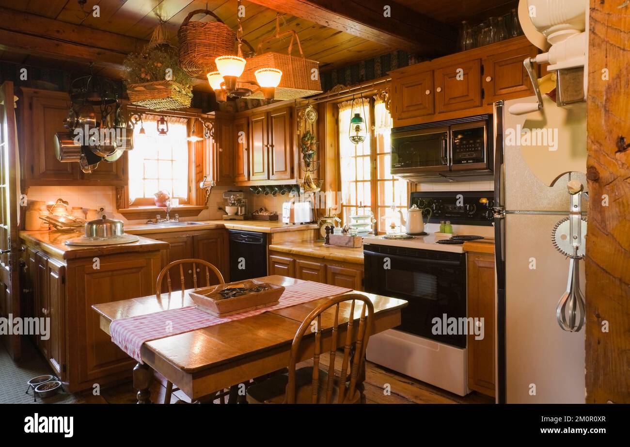 Square dining table and rounded high back chairs in rustic kitchen ...