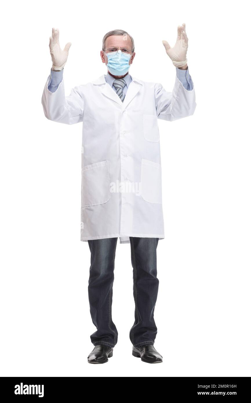 Side view of mature chemist holding up beaker of red chemical in the ...