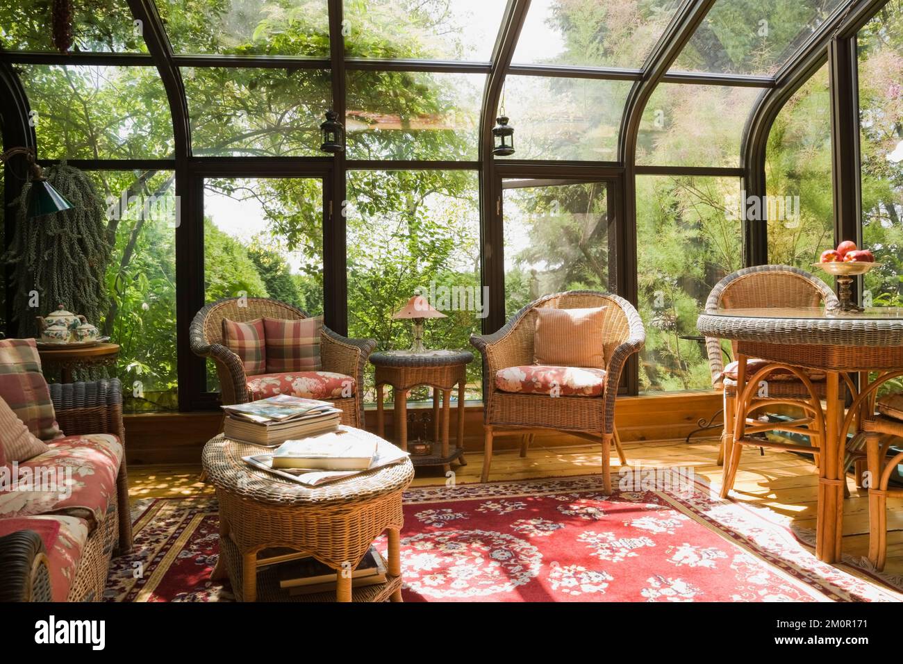 Wicker furniture in solarium room attached to 1977 built replica of old ...