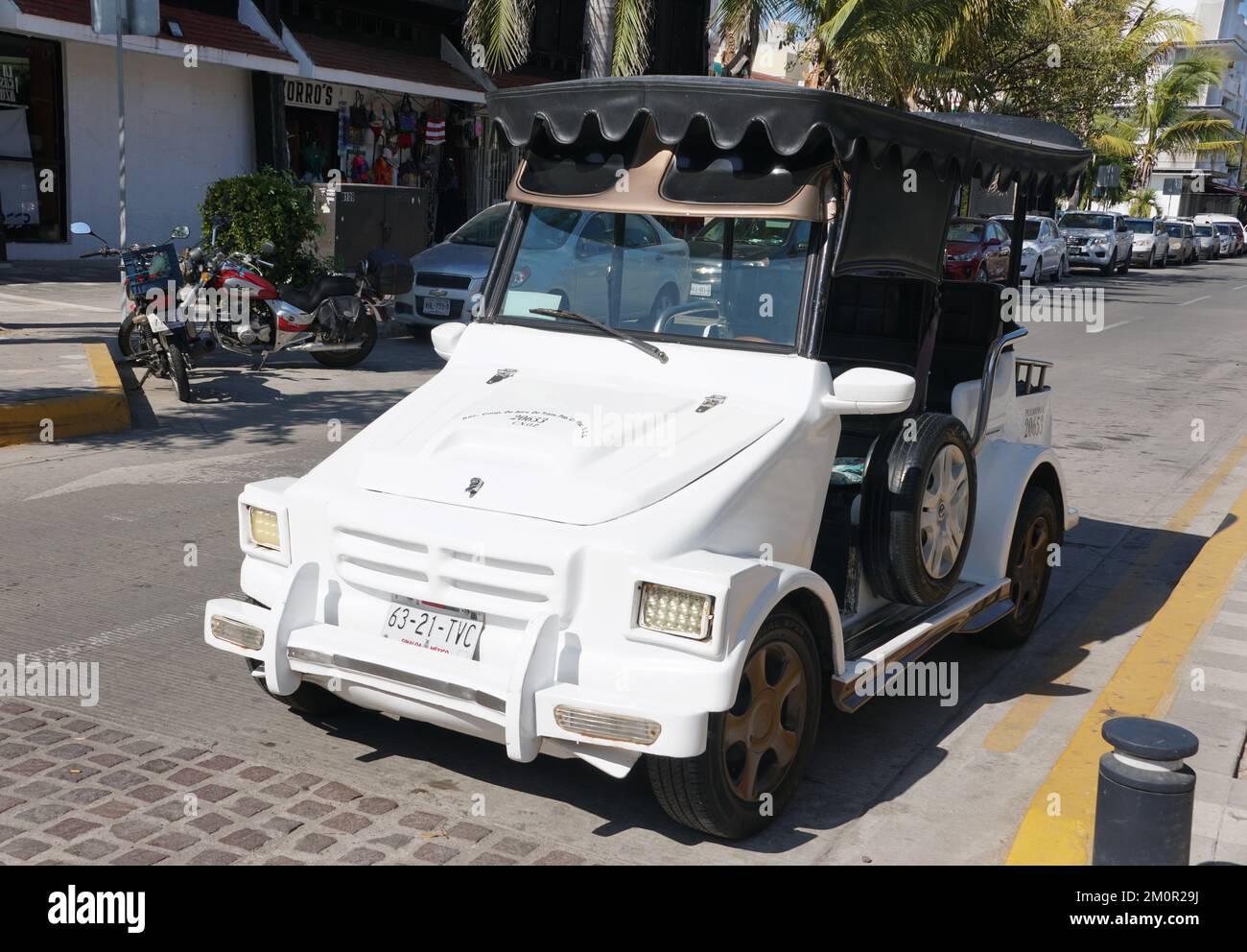 Mazatlan, Mexico - November 9, 2022 - A white Pulmonia, a golf-cart ...