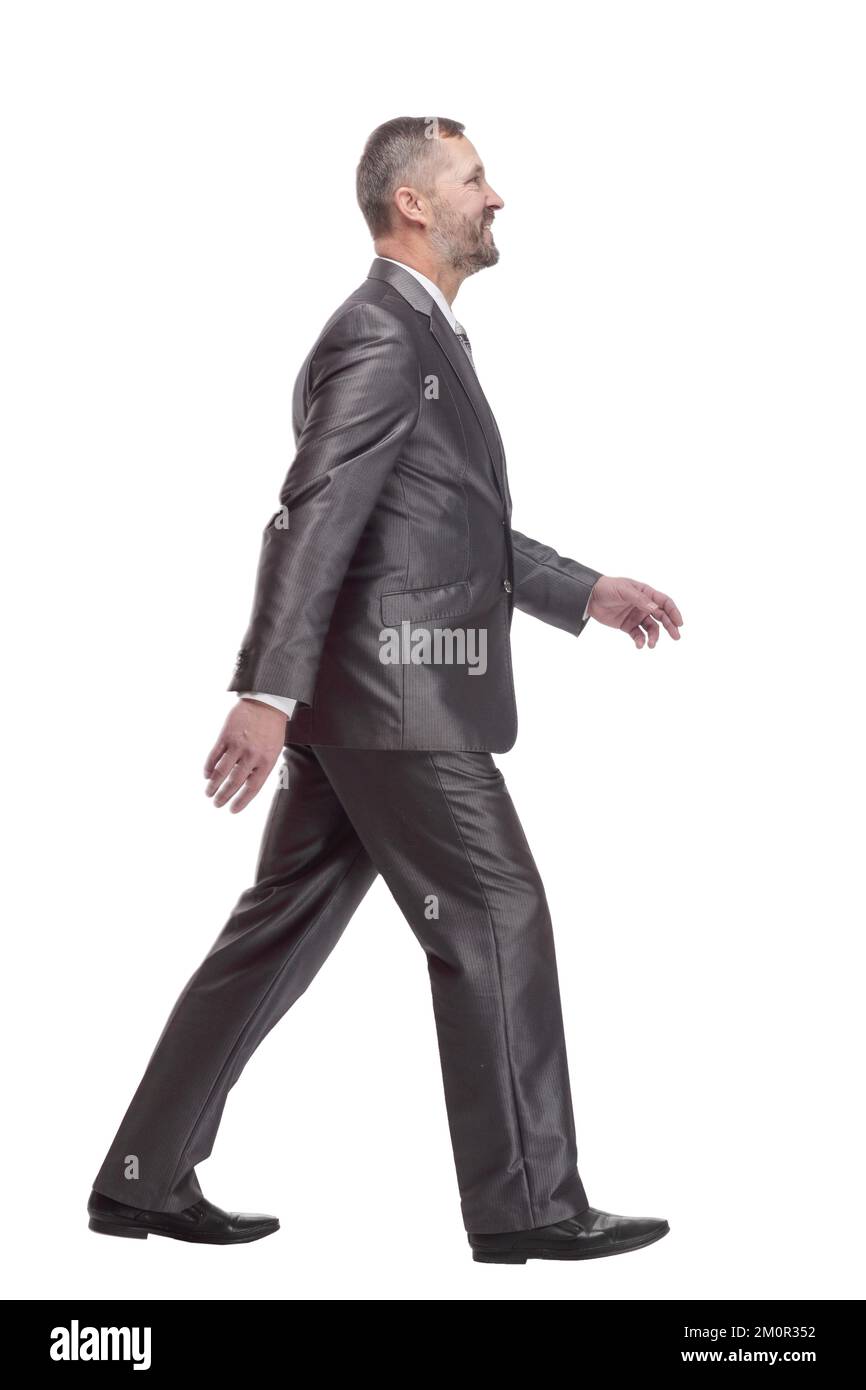 in full growth. confident business man striding forward Stock Photo - Alamy