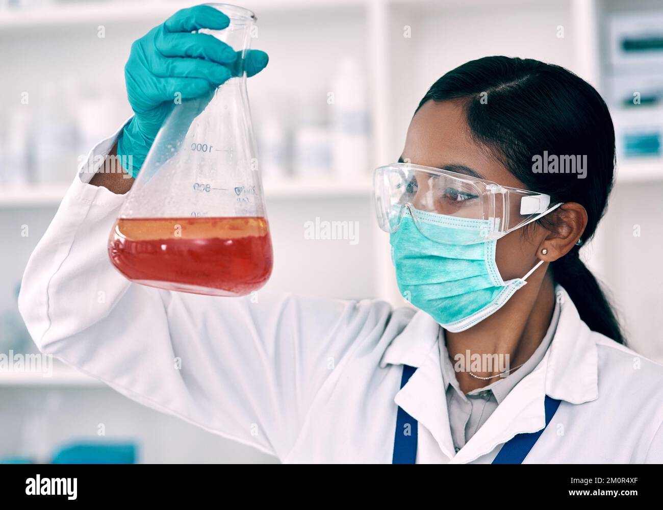 Waiting to observe any changes...an attractive young female scientist ...