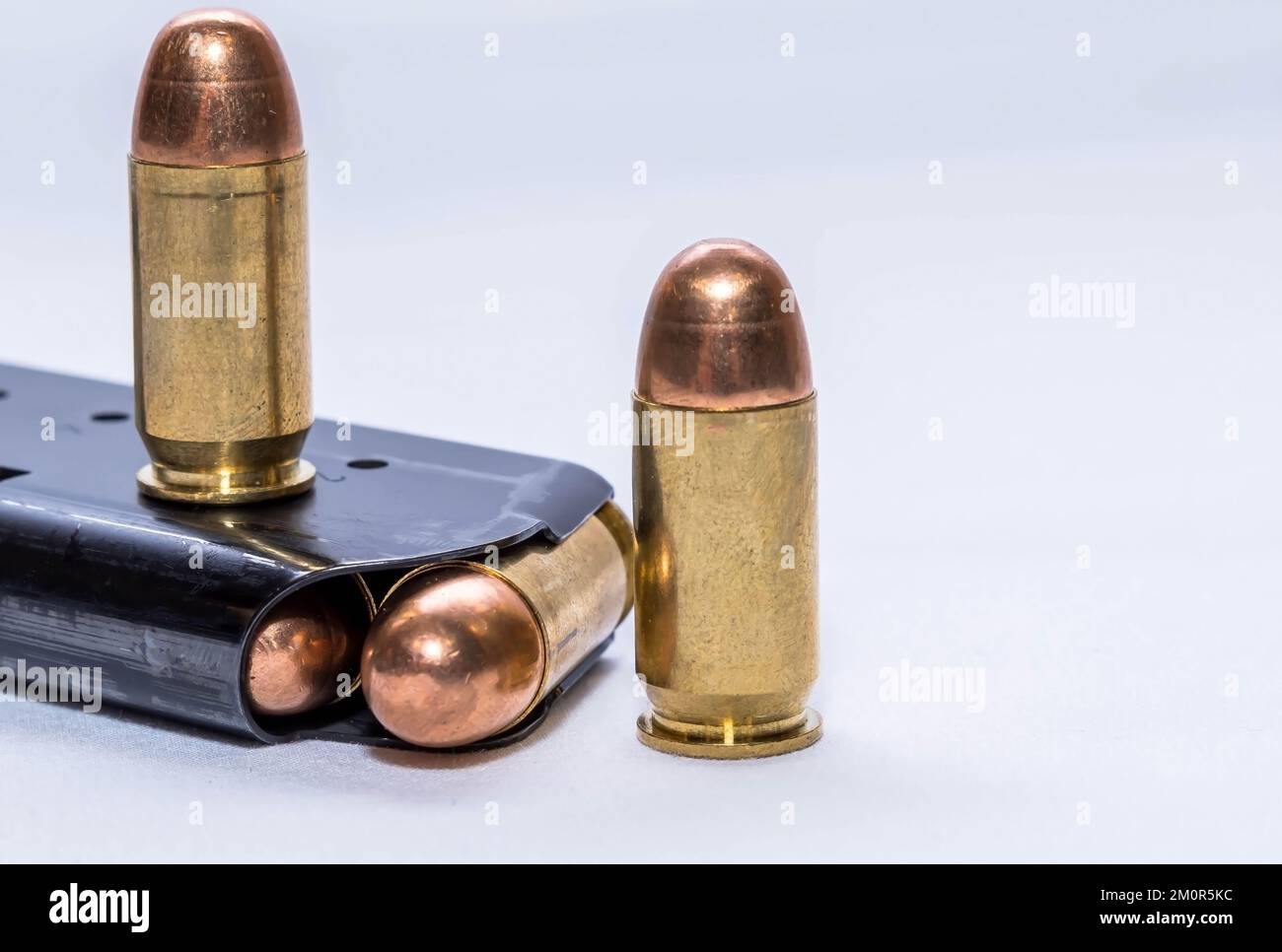 A pistol magazine loaded with 45 caliber full metal jacket bullets with ...