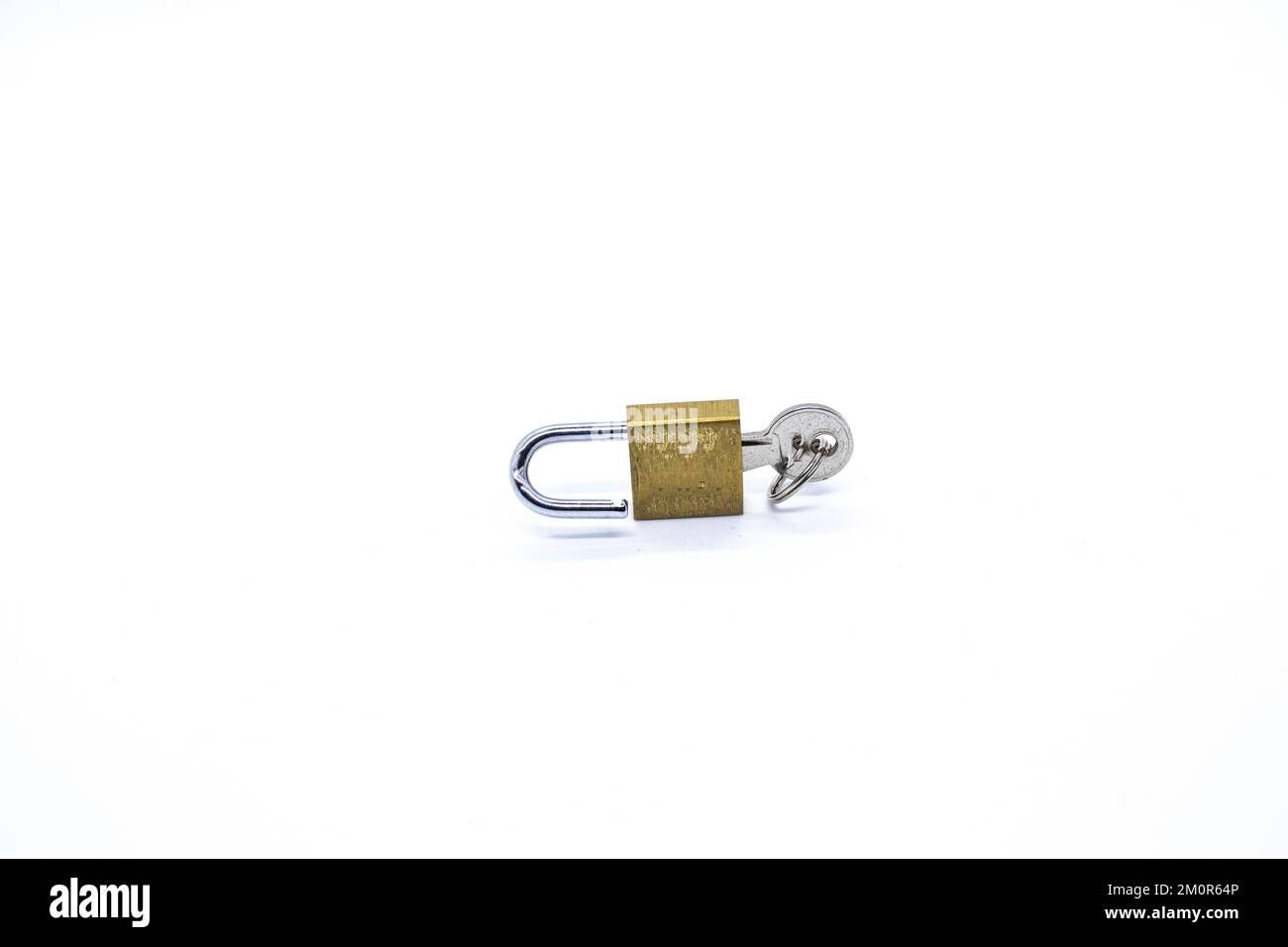 Key inside padlock on white background Stock Photo - Alamy