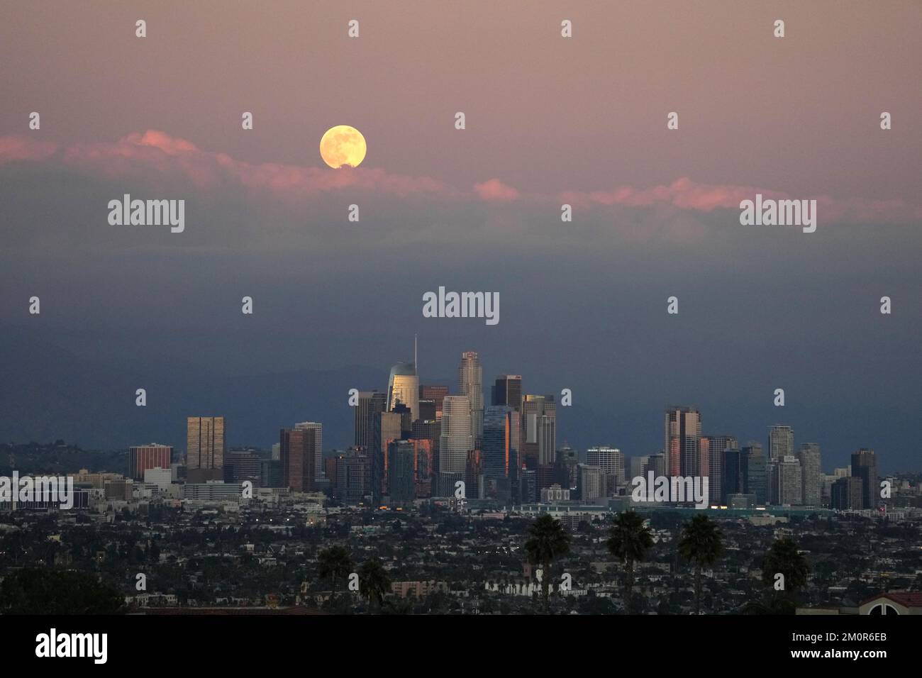 A full moon rises over the downtown Los Angeles skyline on Wednesday ...