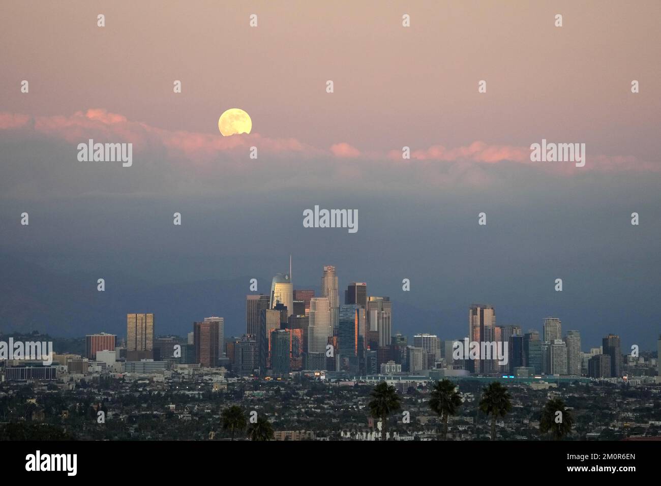 A full moon rises over the downtown Los Angeles skyline on Wednesday ...