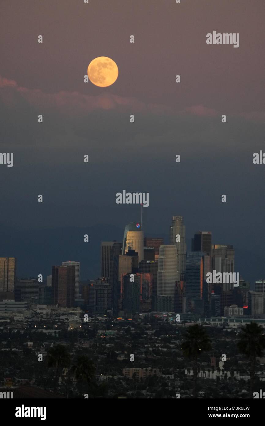 A full moon rises over the downtown Los Angeles skyline on Wednesday ...