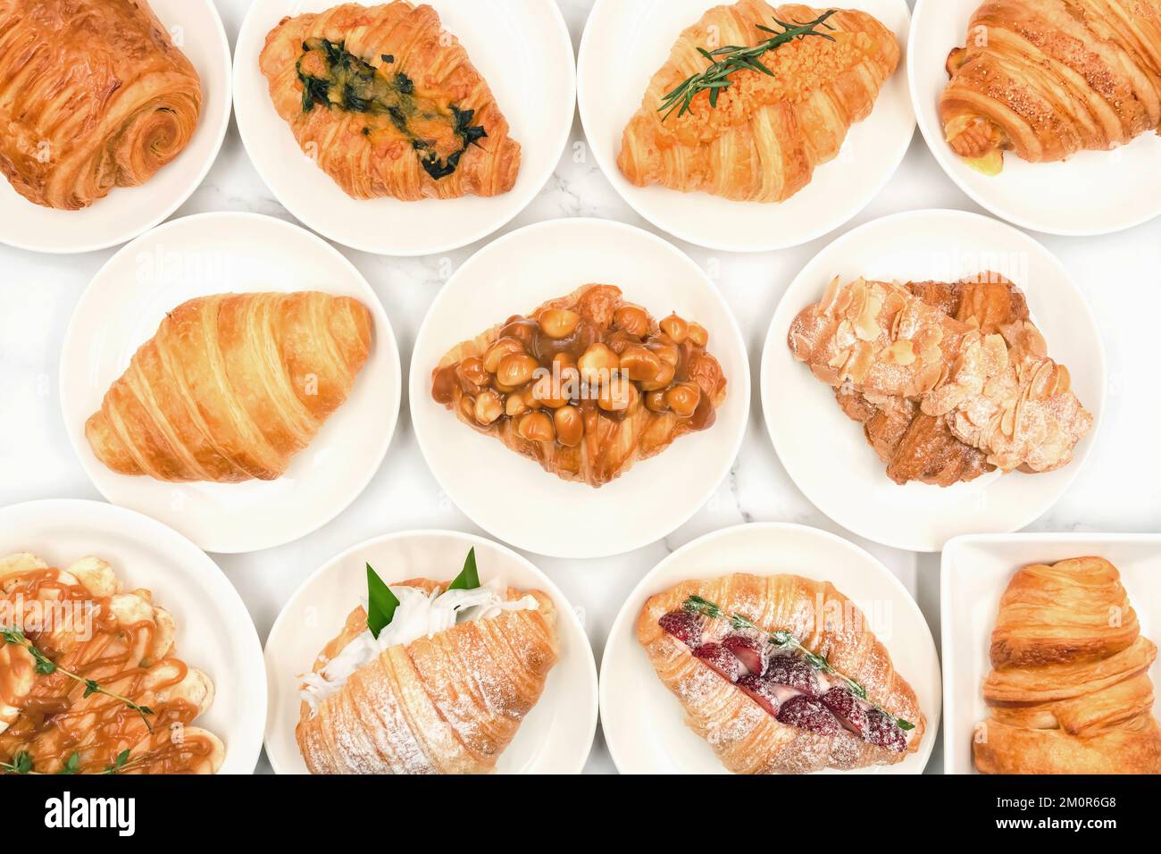 Top view of freshly baked delicious croissants, various types and ...