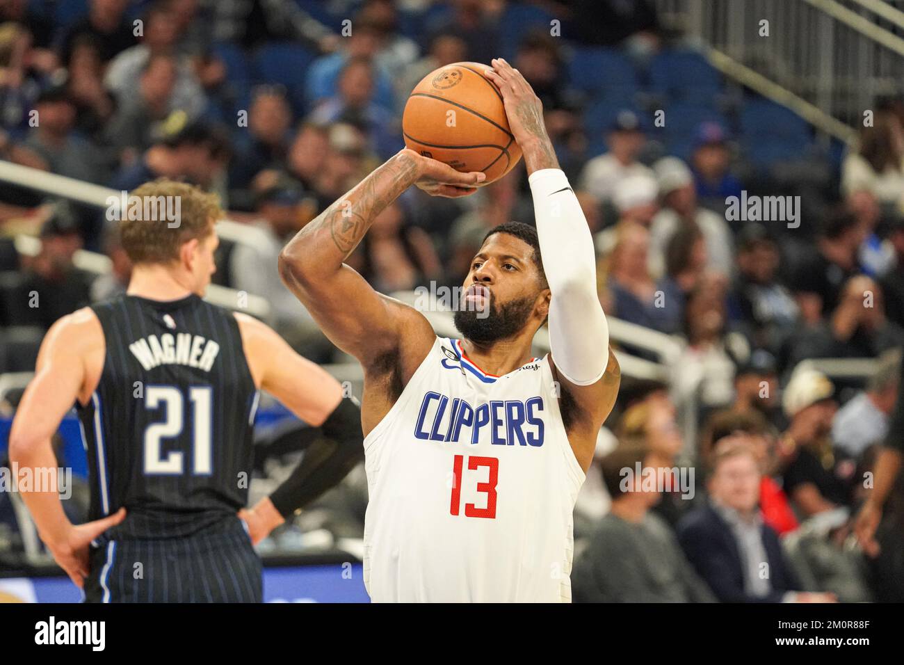 Orlando, Florida, USA, December 7, 2022, Los Angeles Clippers Guard Paul George #13 attempt to ...