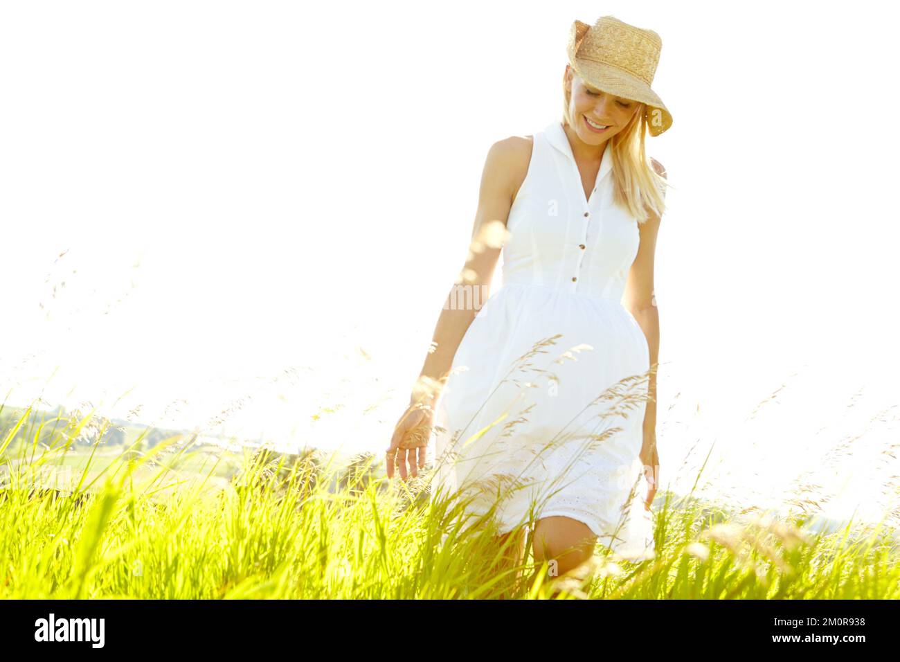 Contemplating natures beauty. A beautiful young blonde woman standing ...