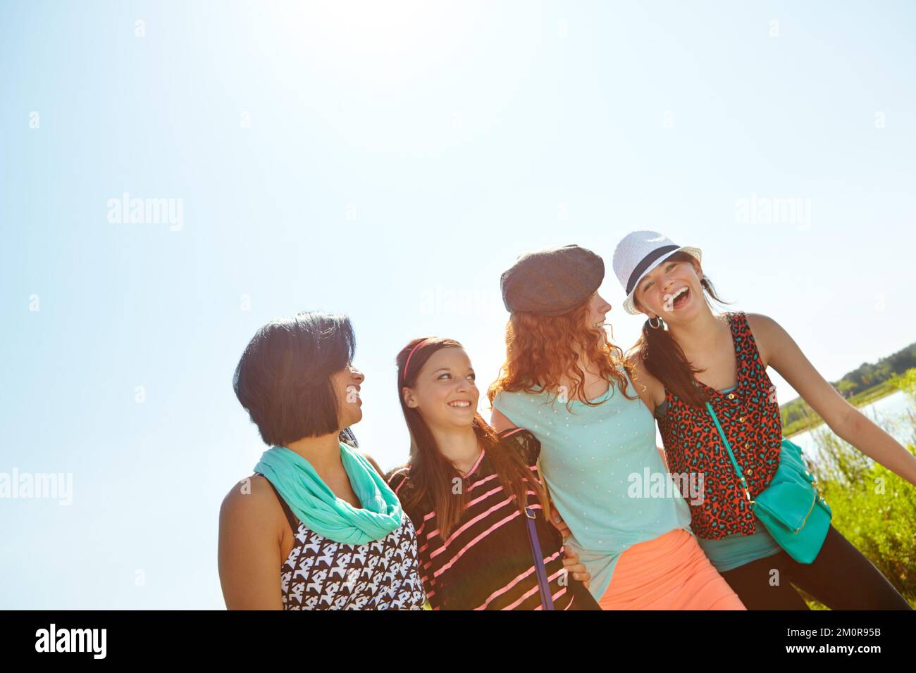 Low angle view of four diverse business executives looking down into ...