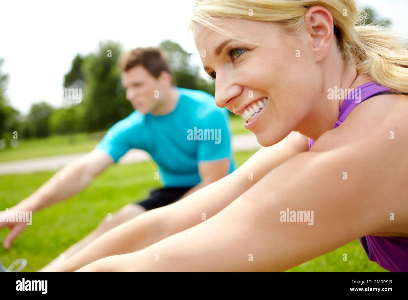Cooling down together. Close up side view of a female athlete ...