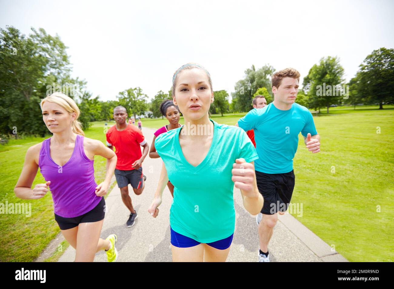 Young athletes running park hi-res stock photography and images - Alamy