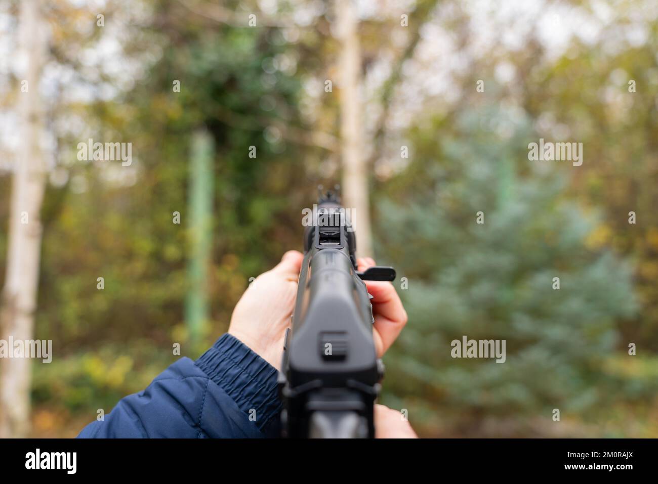 Kalashnikov assault rifle sight from the first person on the background ...