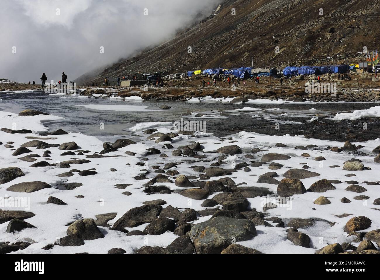 scenic mountain landscape and snow covered river valley at zero point ...