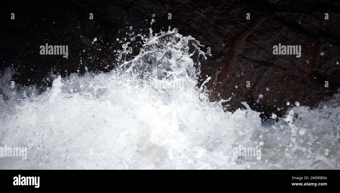 Water splashing against rocks hi-res stock photography and images - Alamy