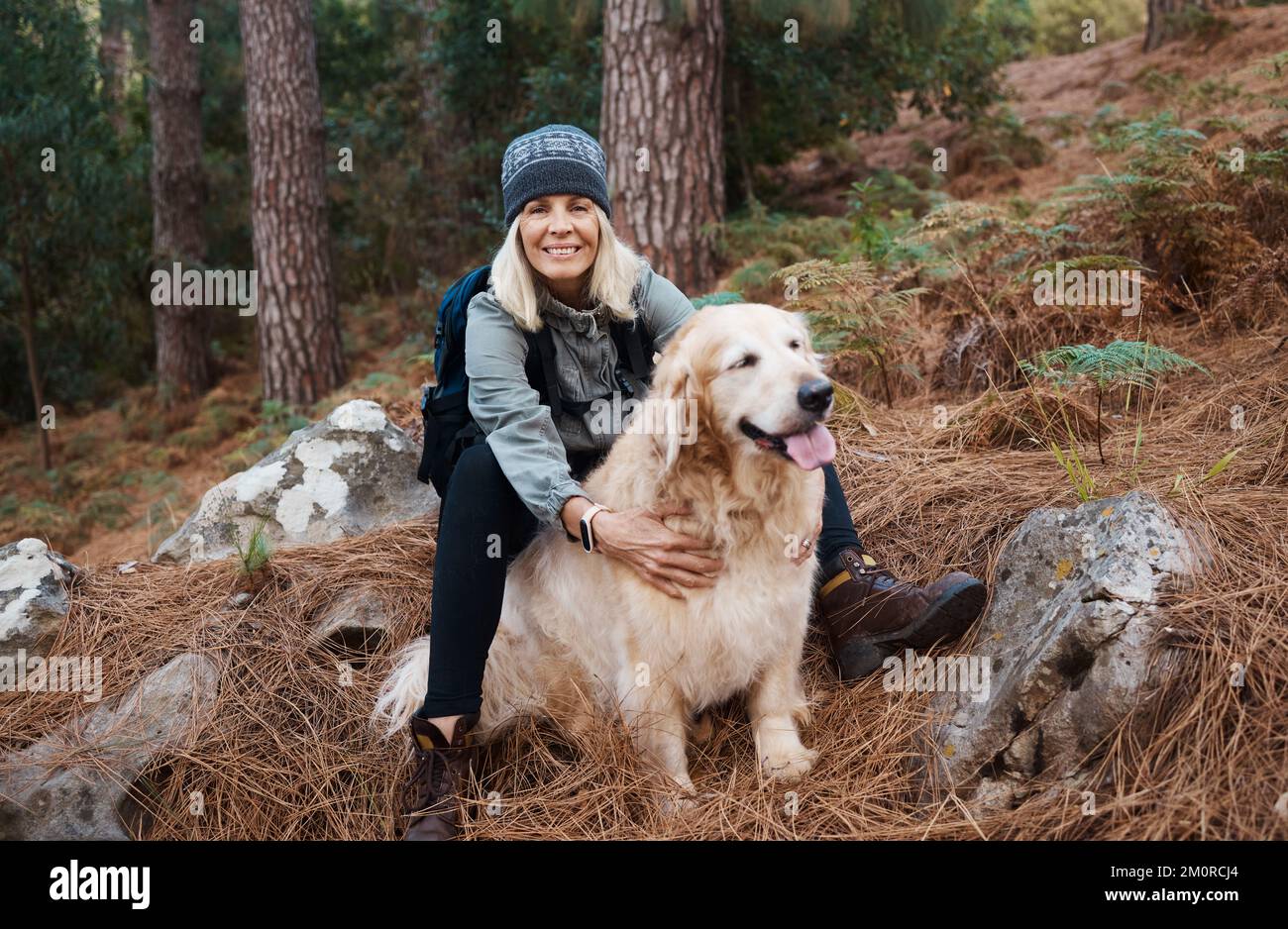 Hiking together helps us to bond. a mature woman out for a hike with ...