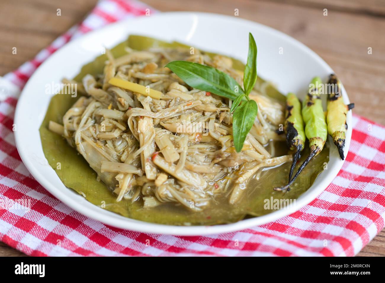 Bamboo shoots for food, Sliced and cooking bamboo shoots on banana leaf ...