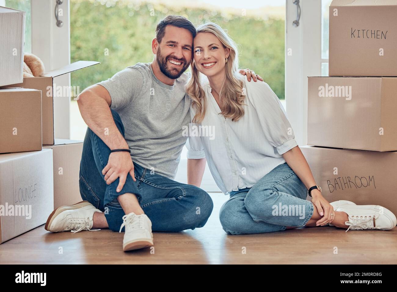 Portrait of couple moving in together. Happy caucasian couple moving ...