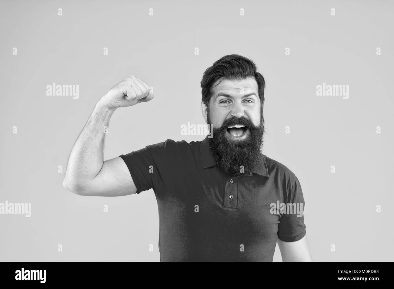 happy strong guy with beard and hairstyle on yellow background ...
