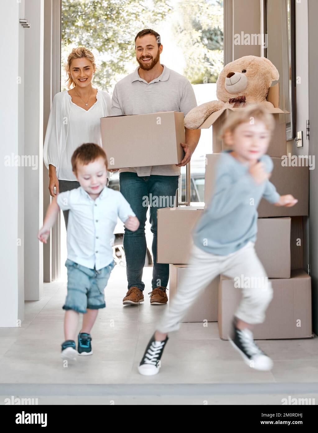 Happy Family Moving Into New House Excited Children Running Into Their