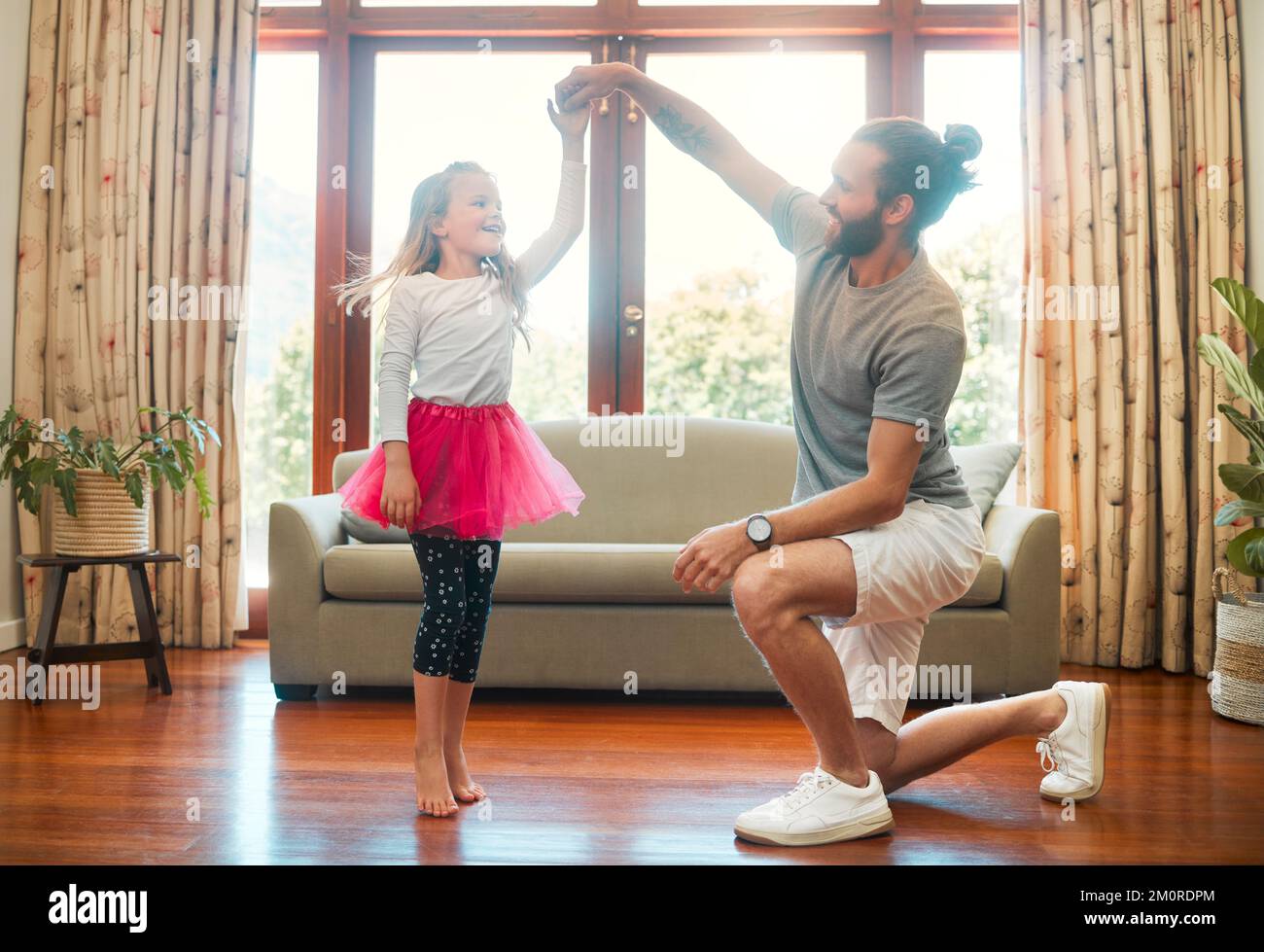 Young happy caucasian father and daughter dancing together in the ...