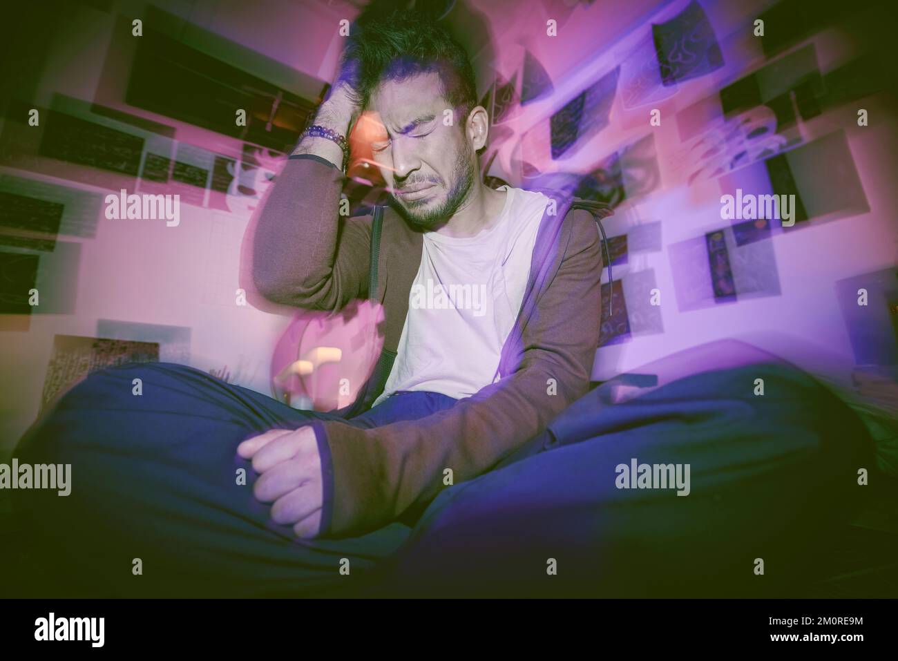 Asian man with mental disorder sitting alone at night and feeling ...