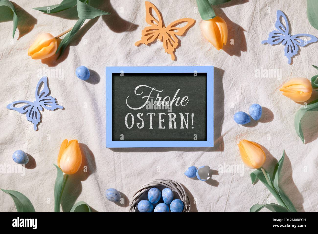 Easter background. Decorated background with blackboard. Text Frohe ...