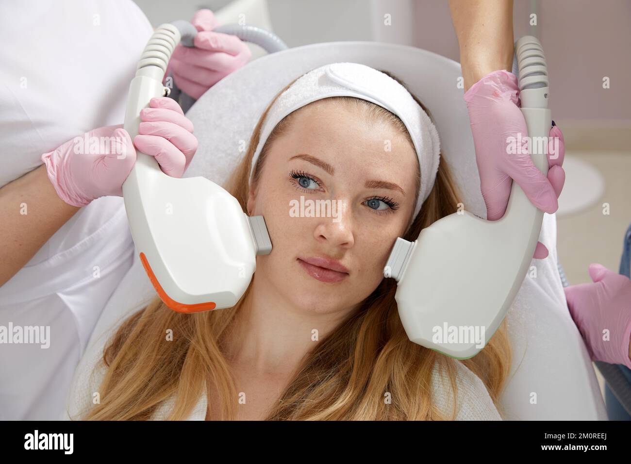 Conceptual beauty and cosmetology image of hands of several doctors ...