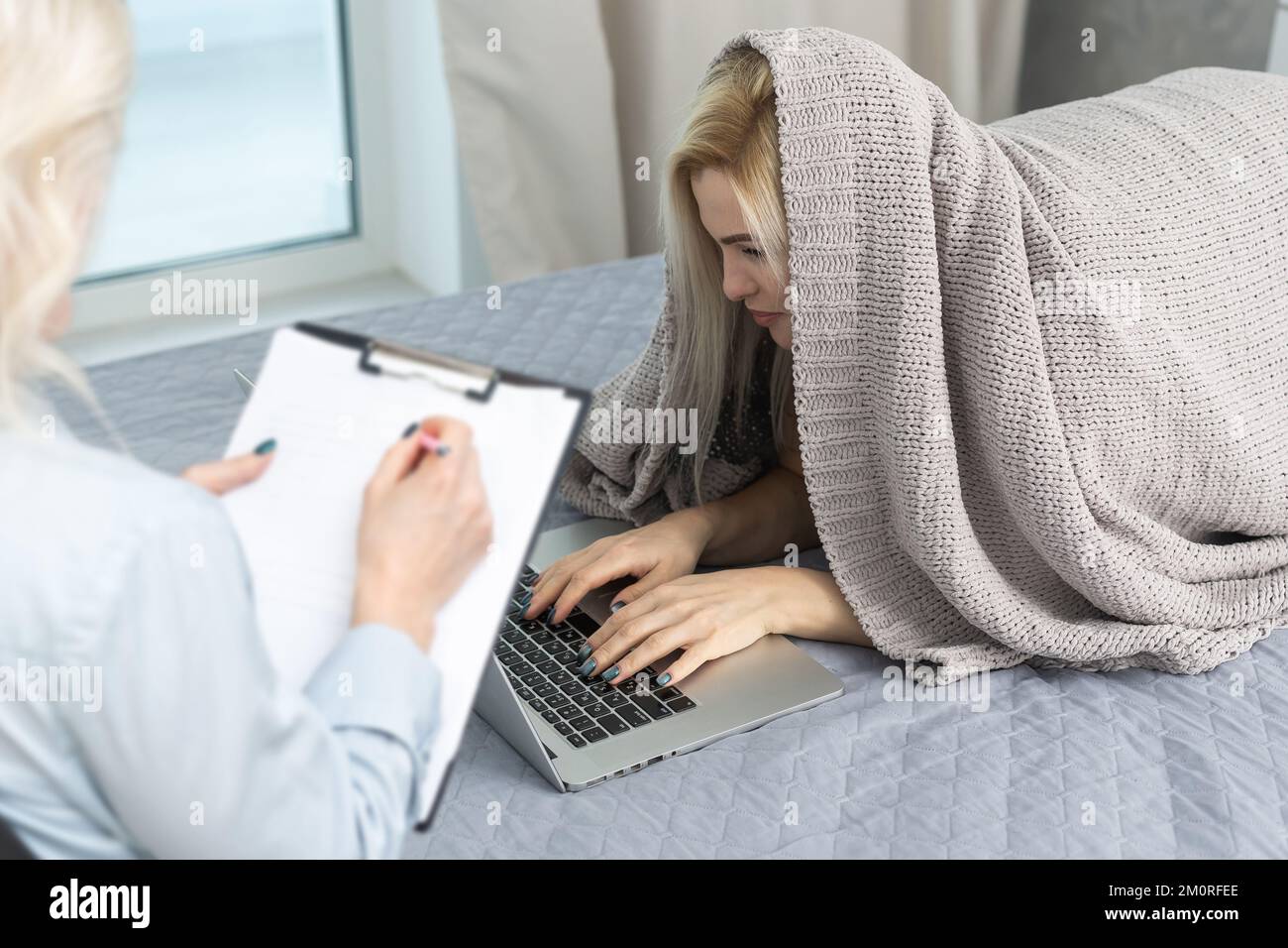 Psychologist comforting a depressed woman during a mental therapy ...