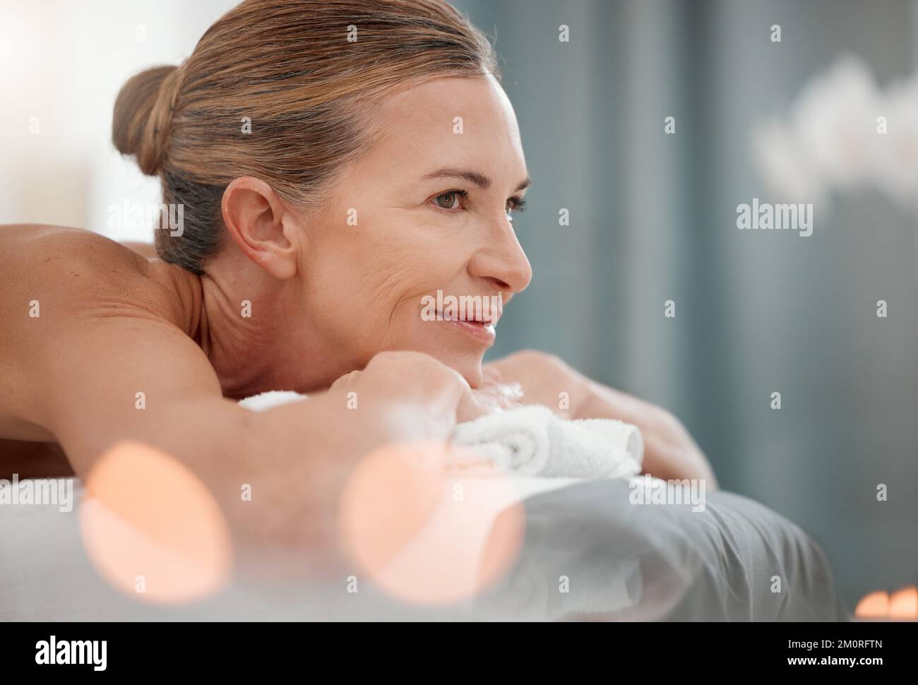 Aligning her chakras and emotions. a mature woman resting in between ...