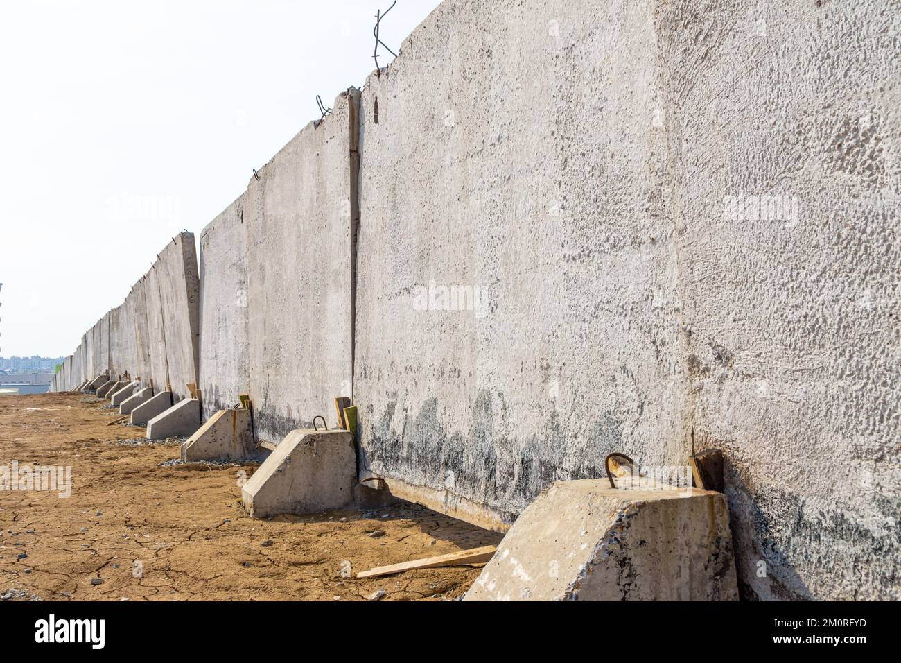 fencing of a construction site from reinforced concrete slabs for the ...