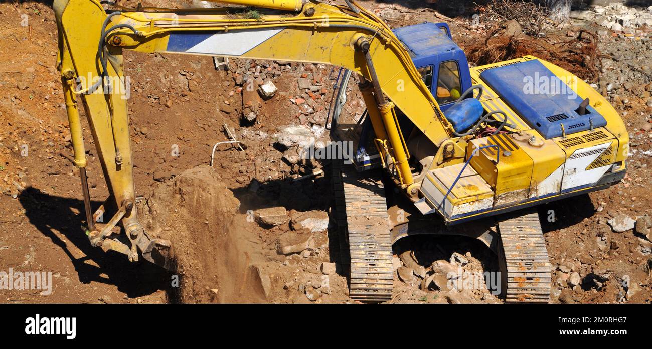 Excavator continues to work at the construction site, excavation site and excavator Stock Photo ...