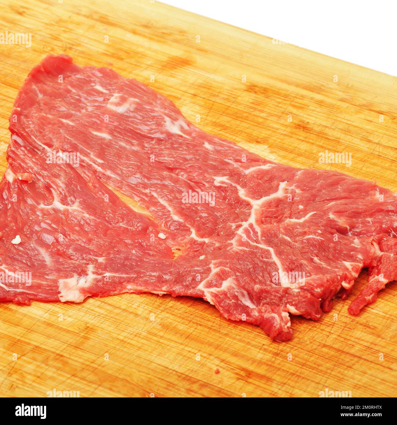 Clean very fresh red raw cow meat beef, bamboo on cutting board Stock ...