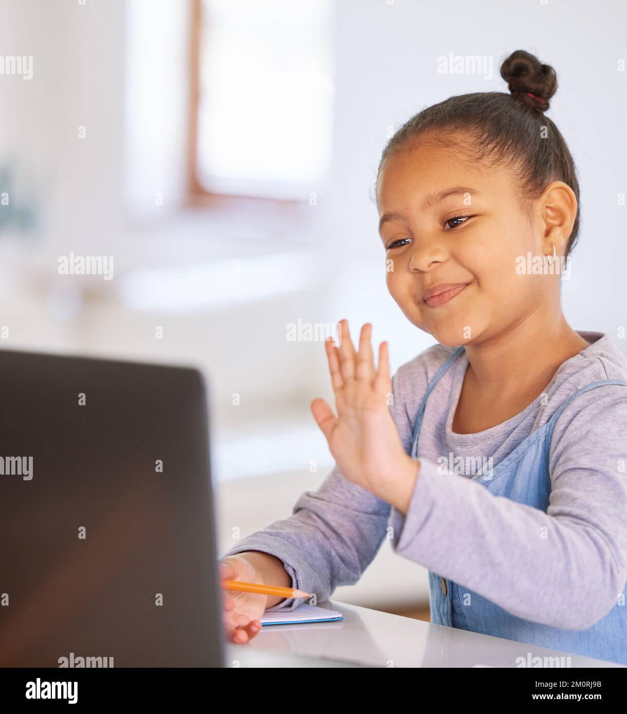One happy mixed race preschool girl waving to teacher or tutor while ...