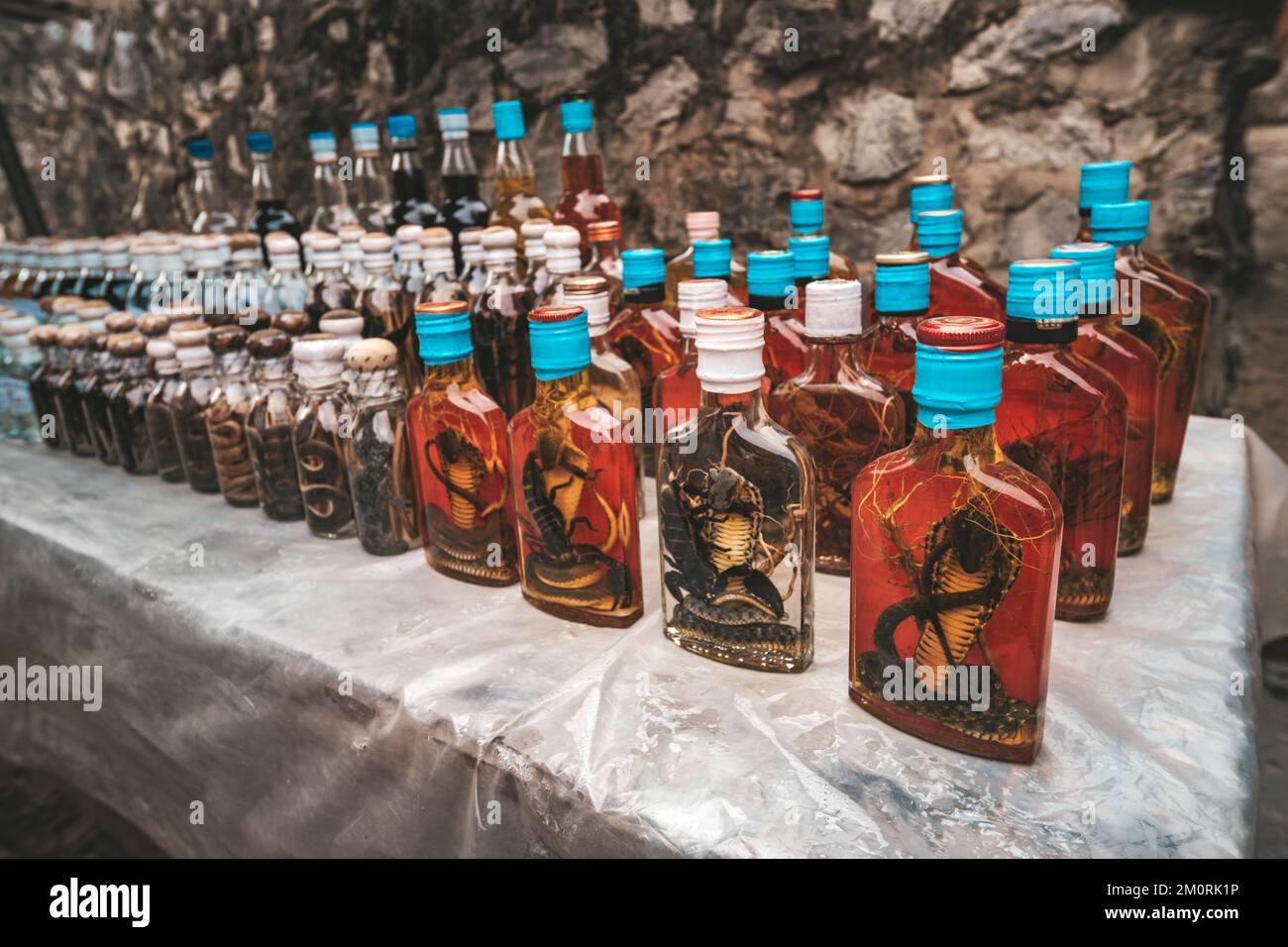 Bottle of liquor or alcohol with cobra inside, some put root's herb ...