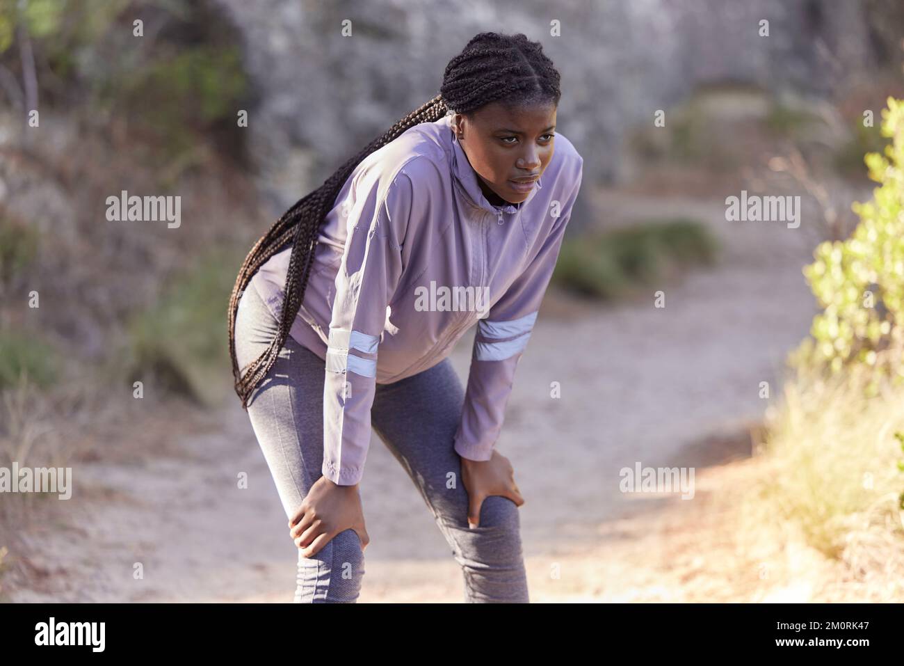 Fitness, mountain and black woman tired from running, marathon training ...