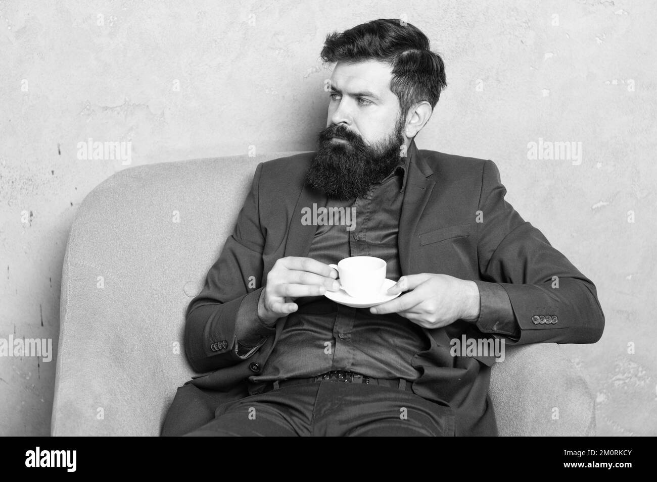 Relaxing professional man drink coffee sitting in rest armchair, coffee ...
