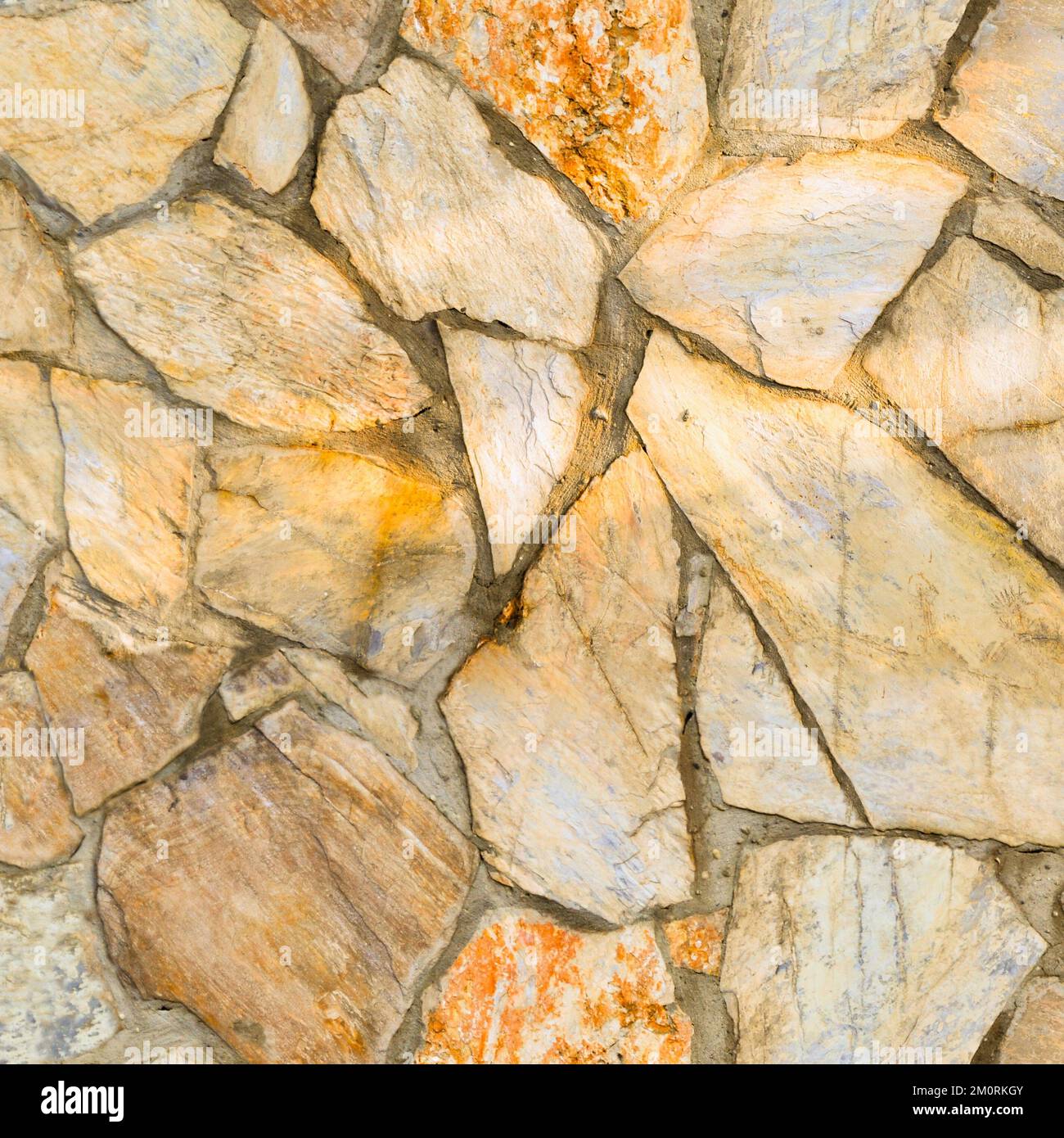 Sturdy yellow and beige cut stone wall, good for backgrounds, seamless ...