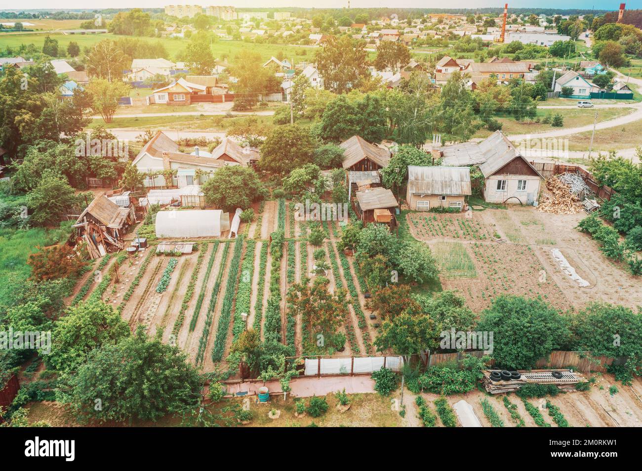 Close-up Aerial View On Houses Of Small Village. Houses And Vegetable ...