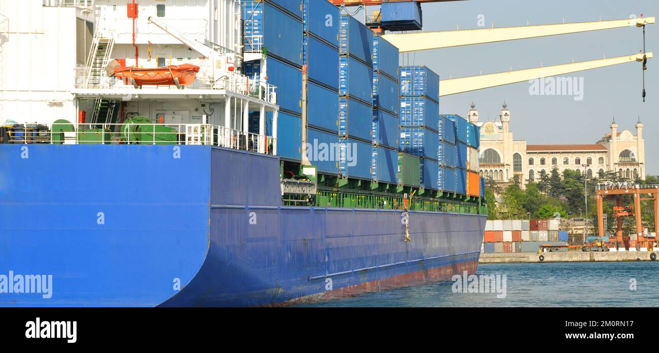 Blue colored cargo ship engaged in international logistics ...