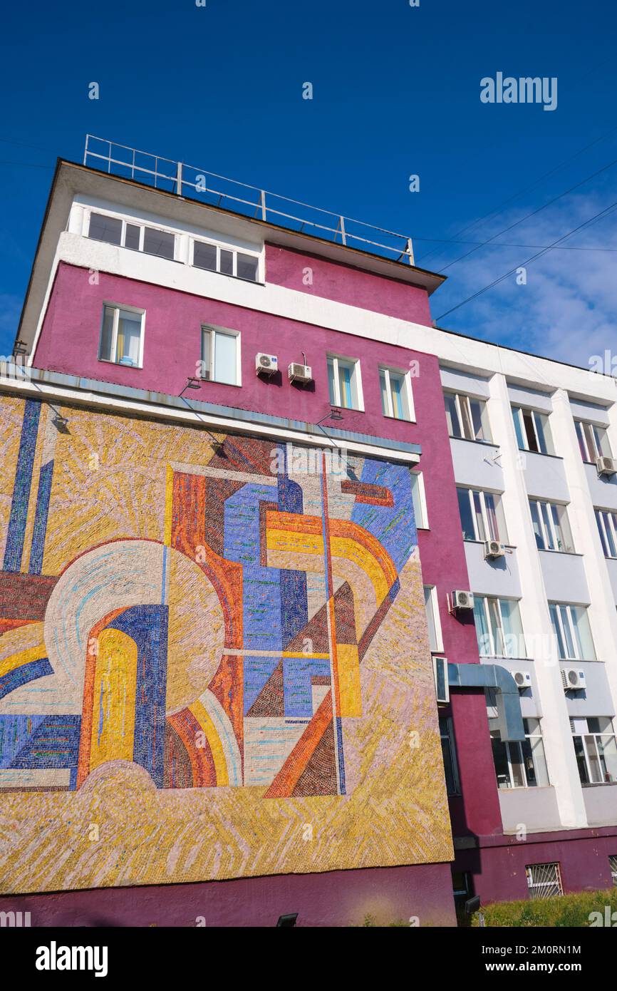 A central Soviet, Russian, Communist era building with a large tile ...