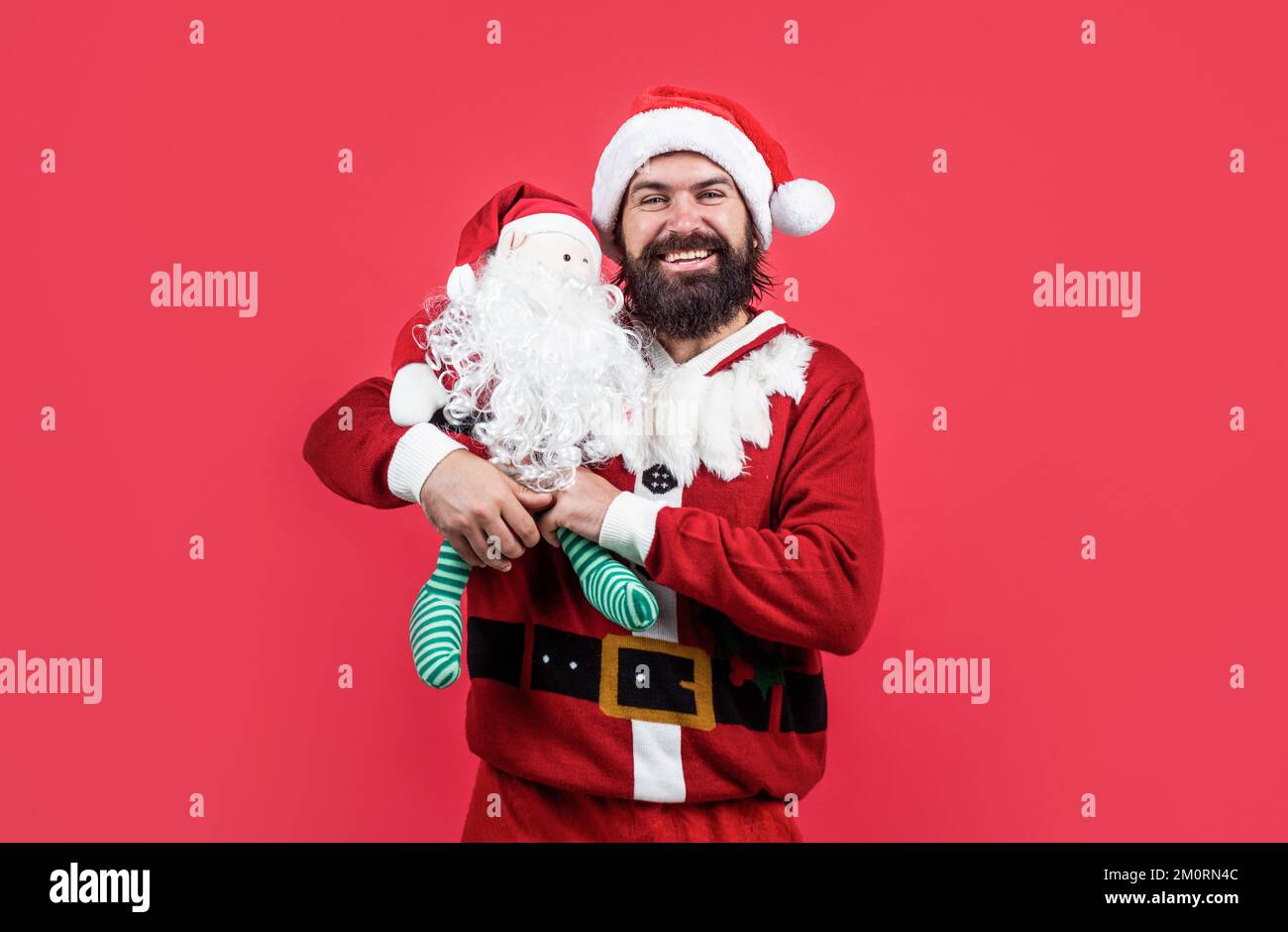happy bearded man with toy in santa claus costume celebrate winter ...