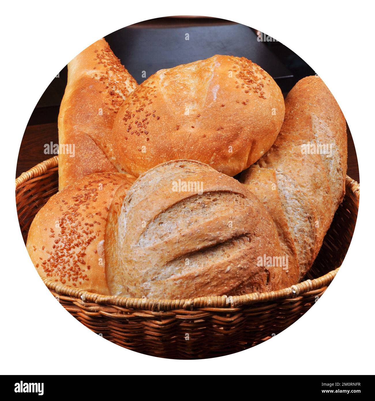 Fresh baked nutritious and golden colored bread homemade, in a wicker ...