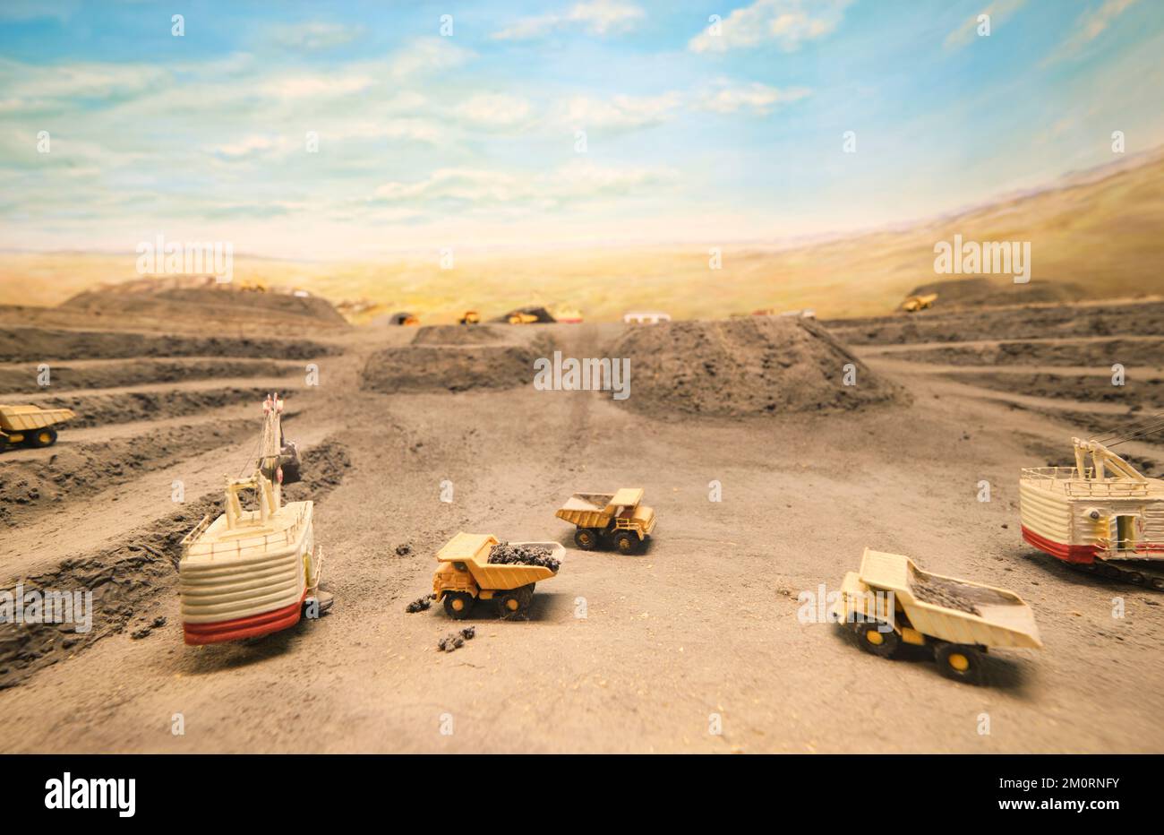 A large diorama, depicting a typical, large strip mine for ore, coal ...