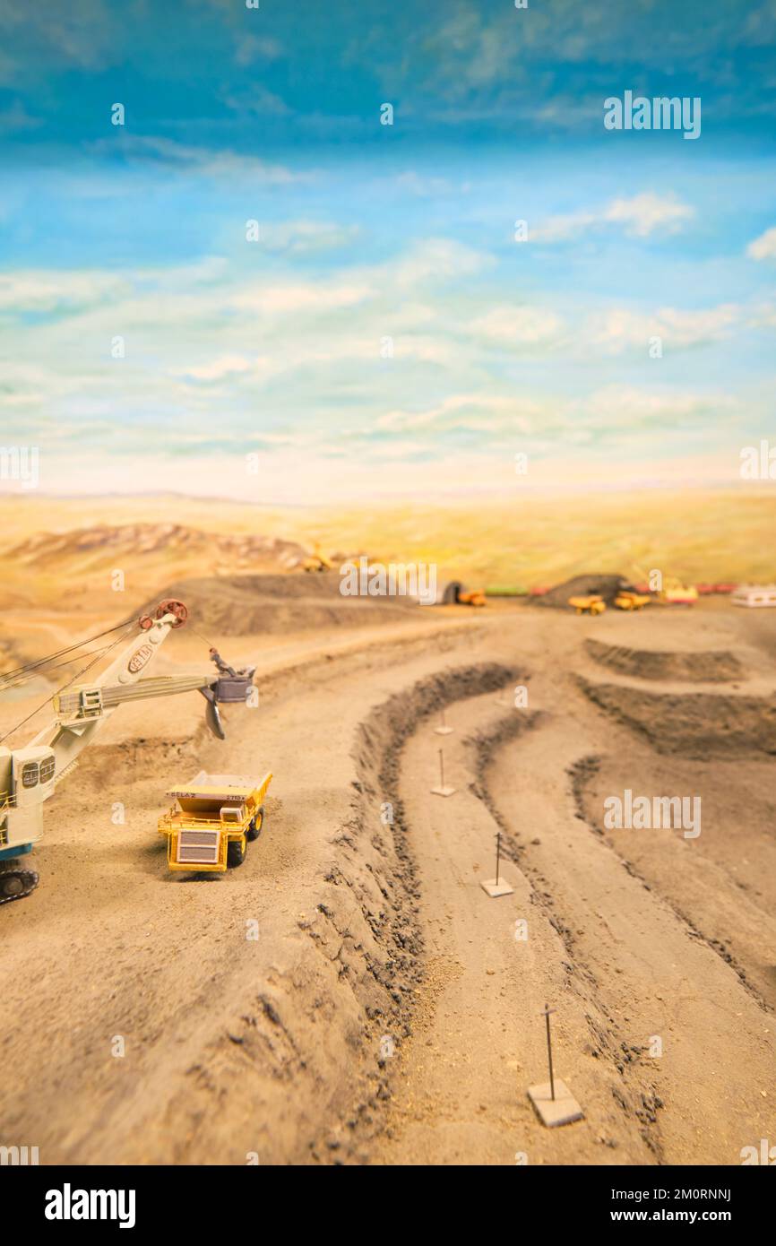 A large diorama, depicting a typical, large strip mine for ore, coal ...
