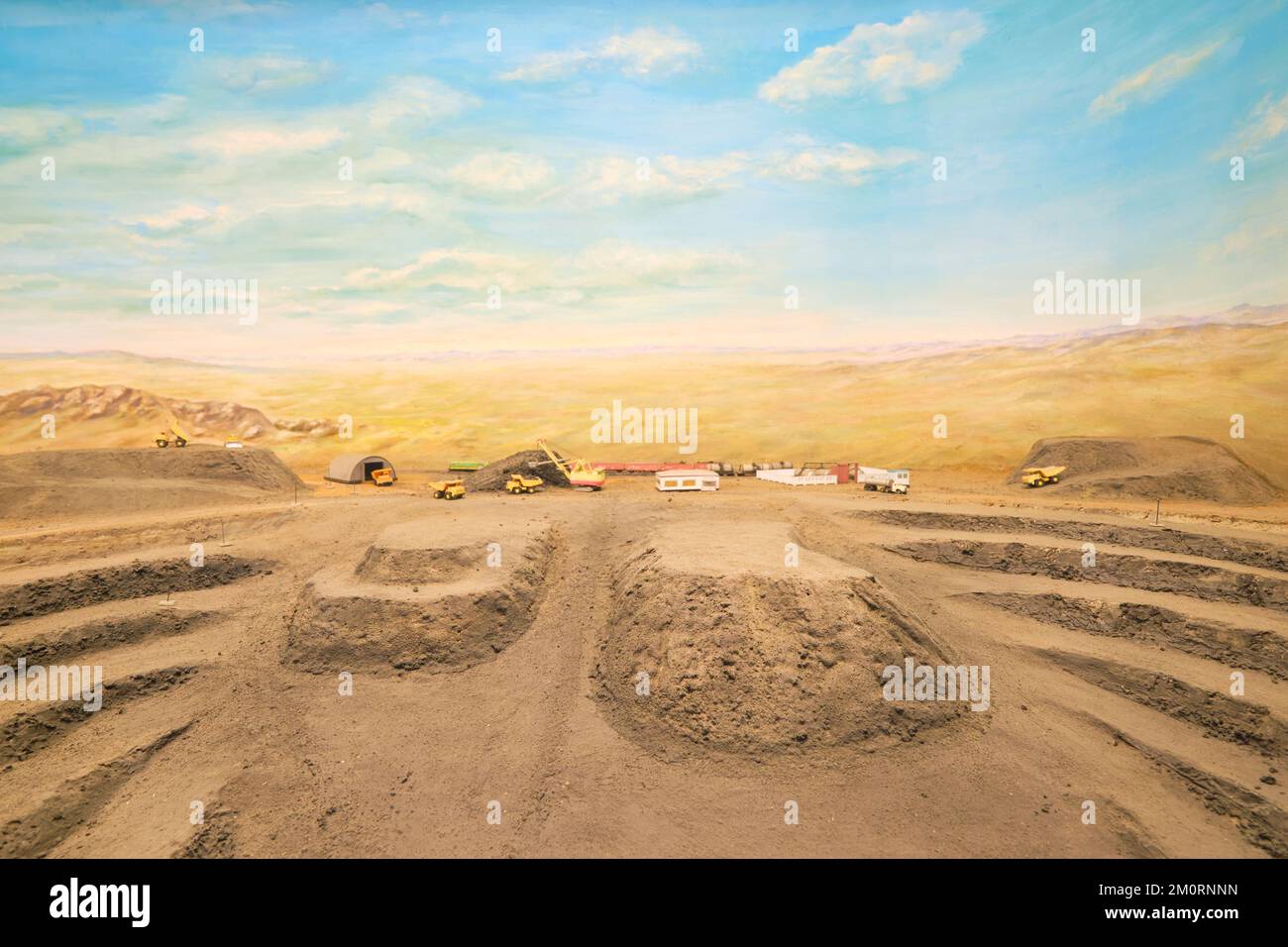 A large diorama, depicting a typical, large strip mine for ore, coal ...