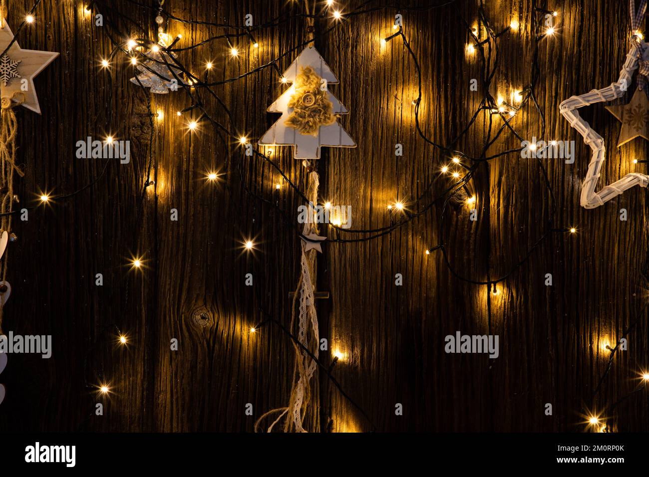 christmas lights and decorations on wooden background Stock Photo - Alamy
