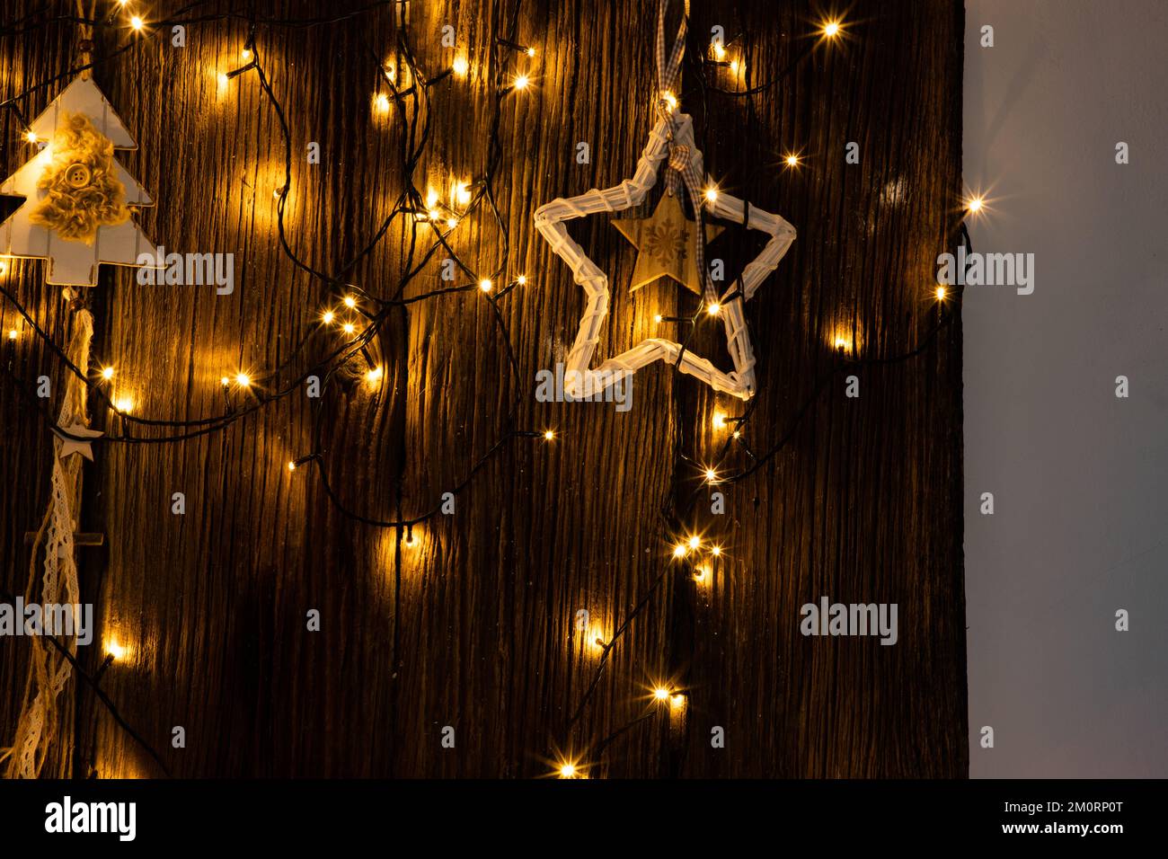 christmas lights and decorations on wooden background Stock Photo - Alamy